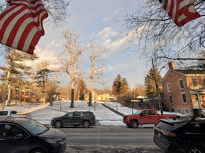 The snowy town square in Aurora becomes a winter wonderland where every footstep feels like history.