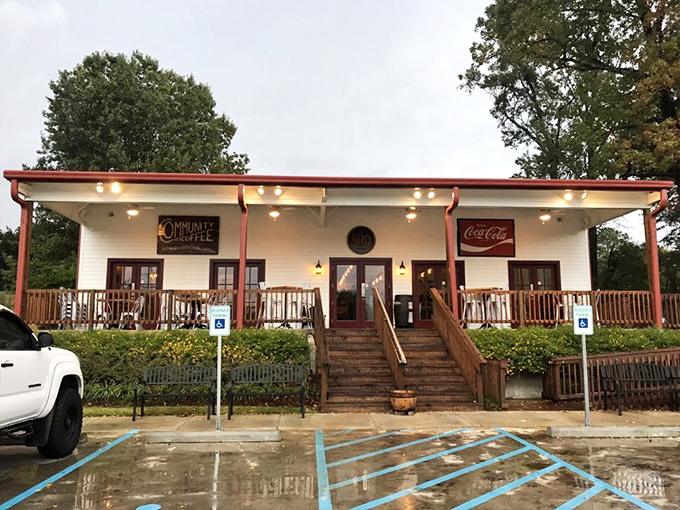 Rain or shine, that covered porch and classic Coca-Cola sign promise comfort food that transcends weather conditions.