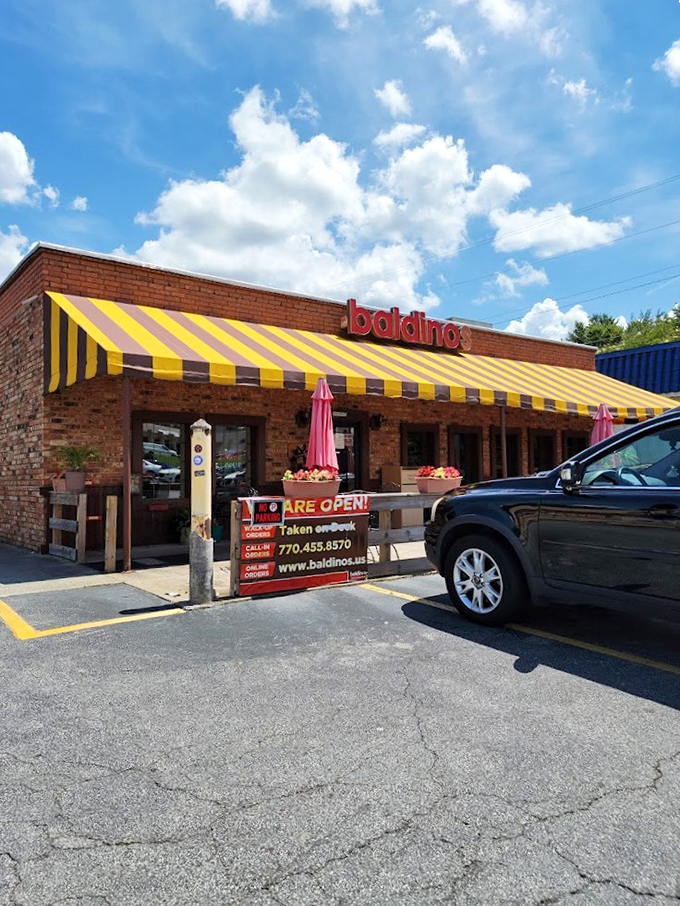 Sunny days and giant subs go hand-in-hand at Baldinos. That brick exterior hides mountains of cold cuts waiting to make your lunch legendary.