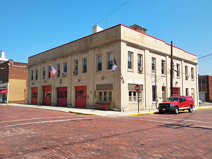These brick facades have weathered countless seasons while maintaining their dignity and small-town architectural pride.
