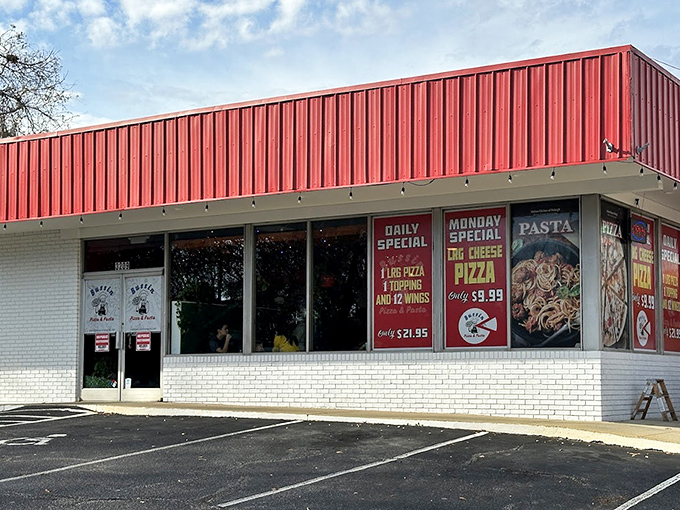 Bussin's striped awning waves like a flag of deliciousness, promising pizza adventures that exceed every expectation.