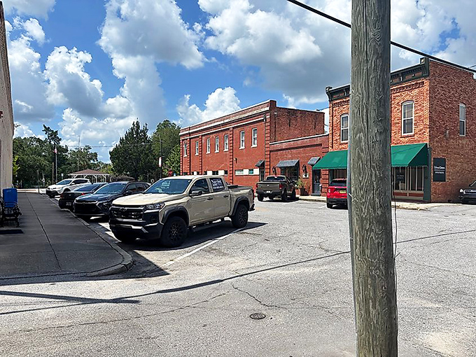 Red brick nostalgia with a side of sunshine! DeFuniak Springs' historic downtown looks like it's waiting for a Norman Rockwell painting session.