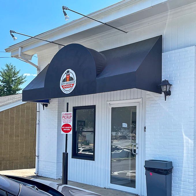 The simple black awning gives no hint of the flavor explosion that awaits inside this unassuming hot dog hideaway.