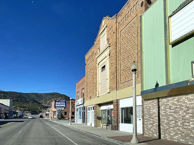 The historic buildings of Ely stand proudly against the clear blue Nevada sky, their brick facades telling stories of copper mining fortunes.