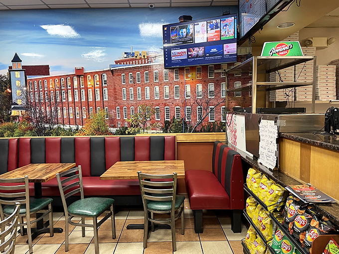 That classic red booth setup screams "authentic neighborhood joint" from every comfortable corner and angle.