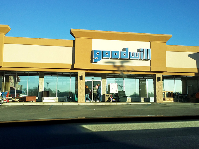 Sunshine bathes this Goodwill in golden light, promising bright bargains inside. The clean storefront offers a hint of the organized shopping experience within.