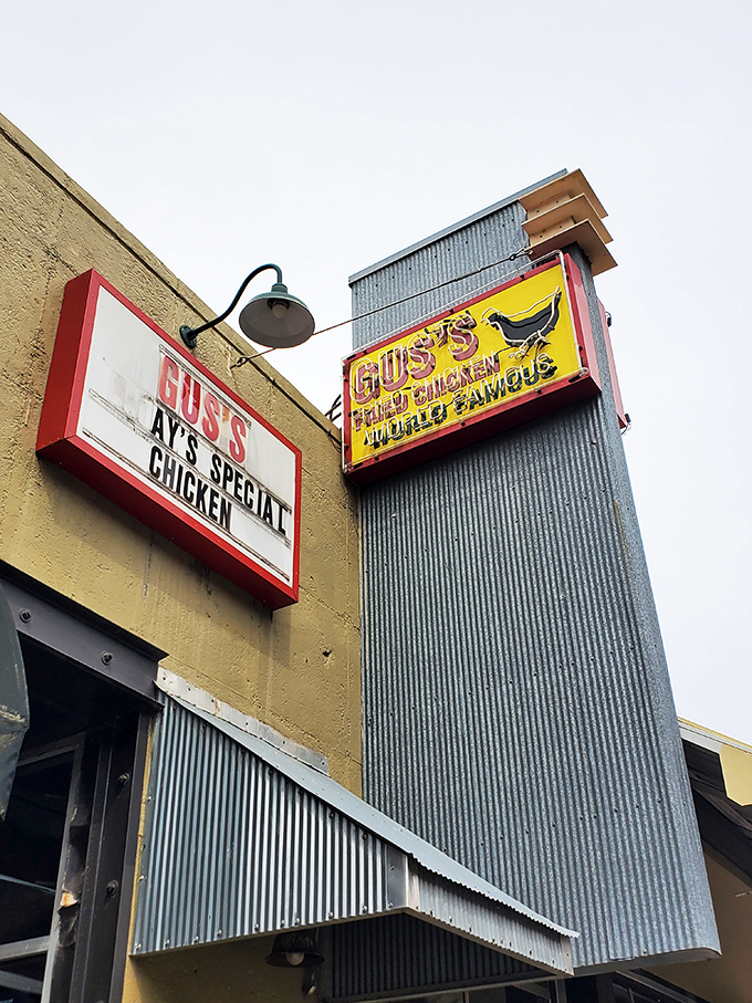 The vintage signage at Gus's promises "World Famous" chicken &ndash; a rare claim that actually delivers.