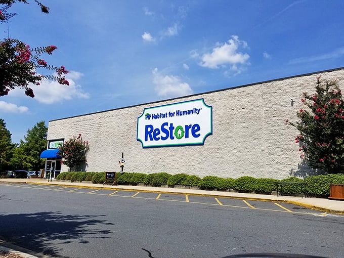 That massive ReStore sign represents more than retail - it's hope, hammers, and home-building all rolled together.