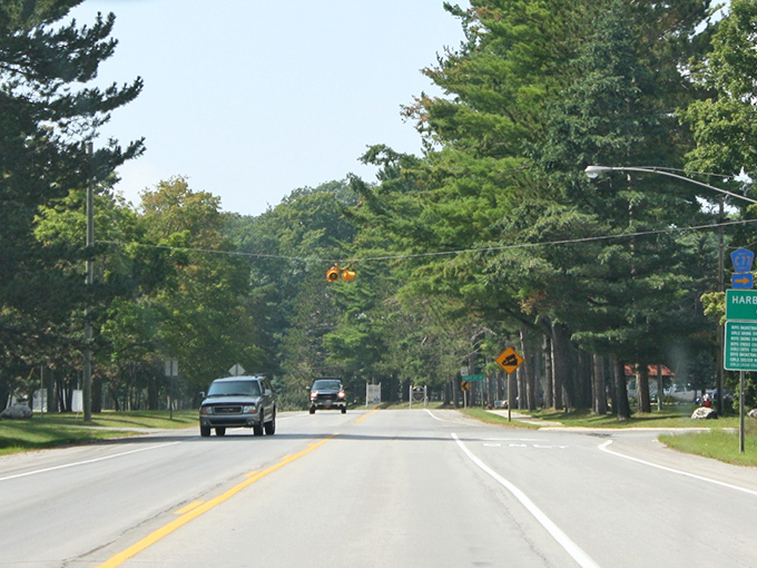 Harbor Springs' tree-lined main street offers a perfect promenade where Victorian charm meets lakeside living.