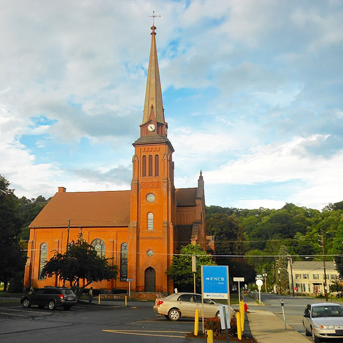 That church spire reaches skyward like it's trying to high-five the clouds on behalf of everyone.
