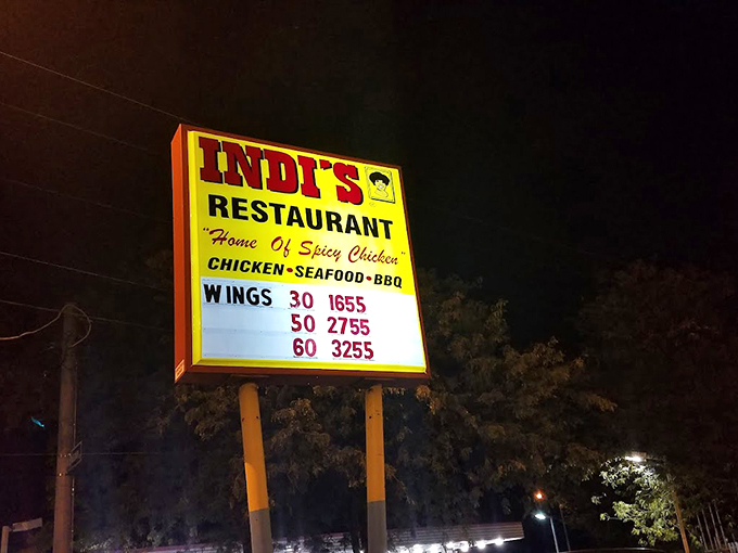 The illuminated menu board tells a delicious story in numbers. 30 wings, 50 wings, 60 wings&mdash;math has never been so appetizing.