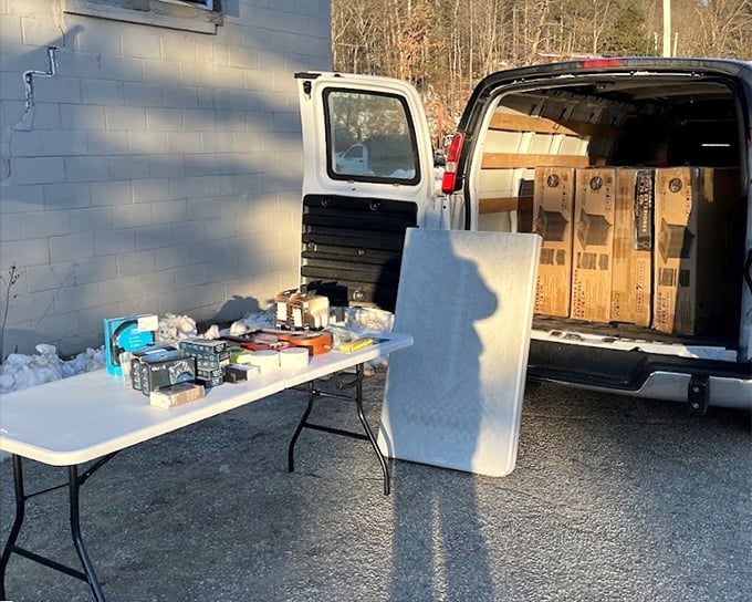 Parking lot pop-up shop! When the merchandise can't wait to meet you, it spills right out of the van and onto folding tables.