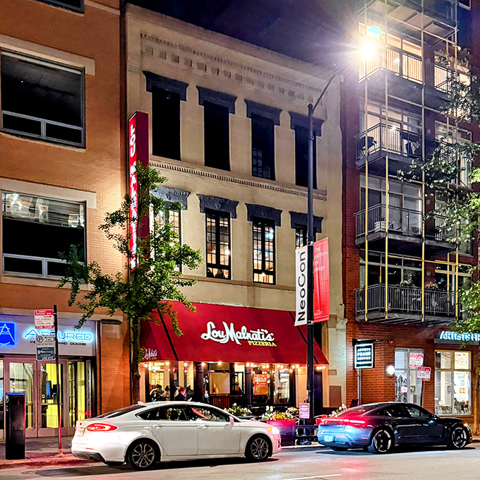 When night falls, Lou Malnati's glows with promise &ndash; a beacon of deep-dish delight in the urban landscape.