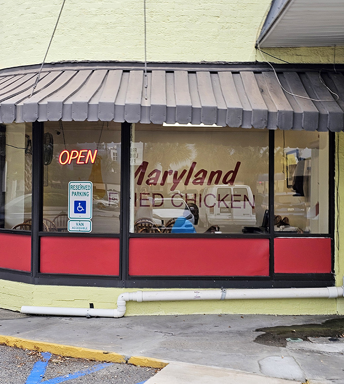 The "OPEN" sign glows like a beacon for hungry travelers seeking Maryland's unique take on pressure-fried chicken.