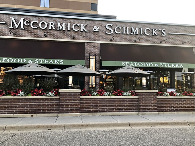 The sophisticated storefront and patio seating hint at the refined coastal dining experience waiting inside those doors.