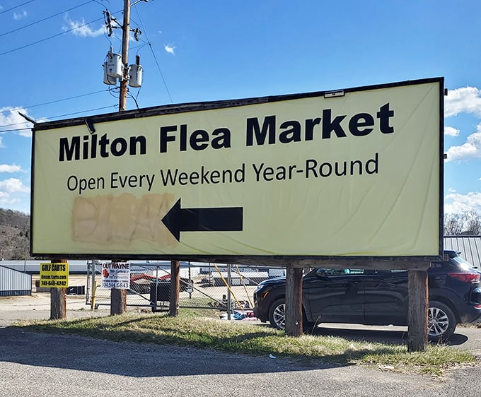 The Milton Flea Market sign points the way to weekend adventures&mdash;follow the arrow to bargain paradise!