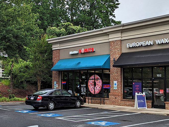 That bright blue awning at MoMo Donuts is like a beacon of hope on mornings when only sugar and caffeine will do.