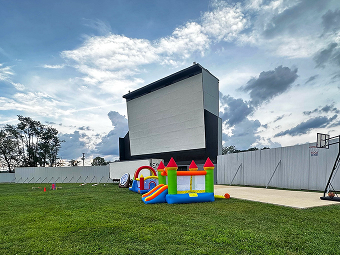 White screen against blue skies at Moonlite Drive-In. Soon stars will appear both on-screen and overhead in perfect harmony.