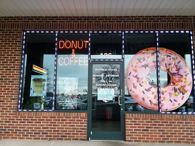 The neon "DONUT & COFFEE" sign in the window speaks the universal language of morning happiness.