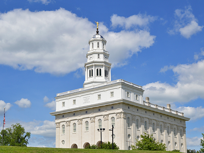That temple crowns the hill like hope itself, gleaming white against the endless prairie sky.