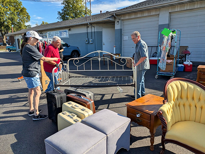 Serious furniture shoppers and friendly staff make outdoor bargain hunting a social event at New Life Thrift.