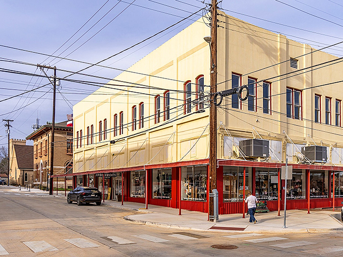 This corner building captures the everyday rhythm of downtown life, where history and local business meet on sunlit streets.
