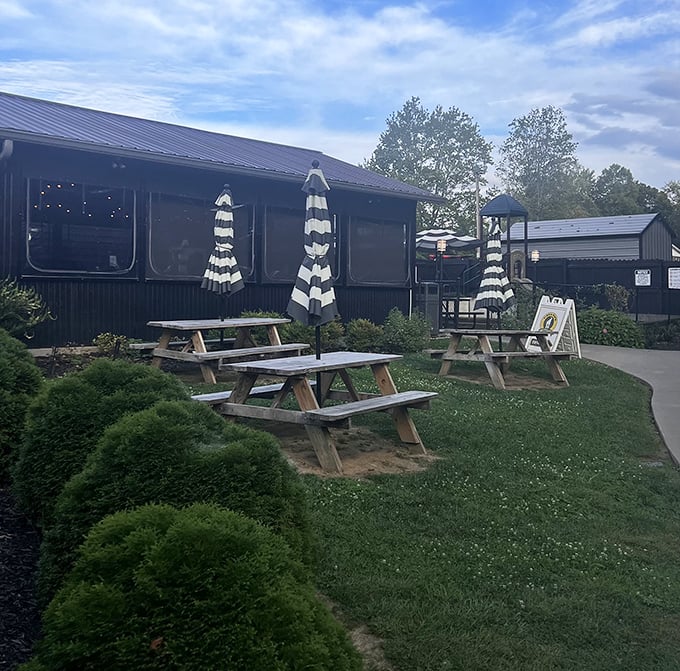 Picnic tables and mountain air create the perfect backdrop for enjoying creative pies and cold pints.