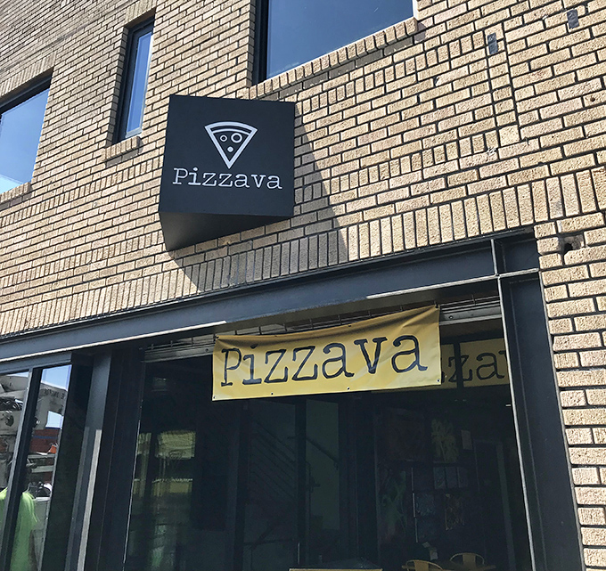 That simple black sign is the culinary equivalent of a poker face hiding a royal flush of flavor.