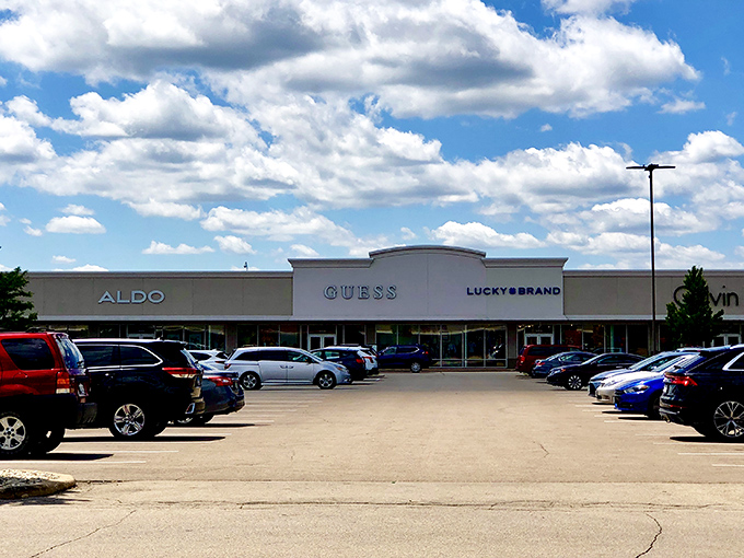 Pleasant Prairie Premium Outlets' clean, modern storefronts line up like soldiers in the retail revolution. Those GUESS and ALDO signs promise fashion at friendly prices!