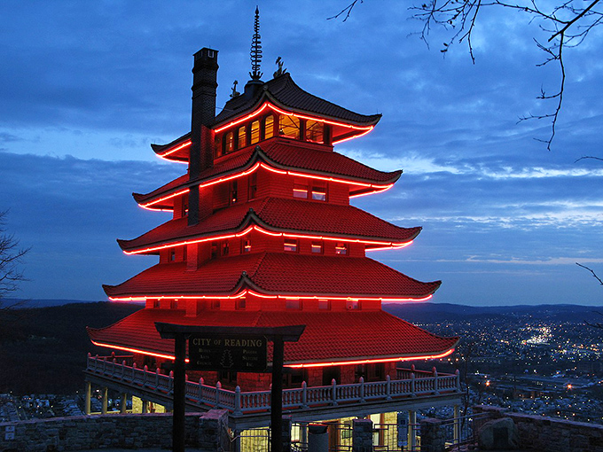 Reading's famous Pagoda glows red against twilight skies. This unexpected Asian-inspired landmark has watched over the city for generations.