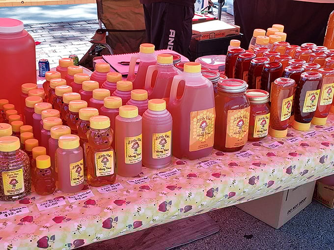 Liquid gold convention! These honey bottles stand like sweet soldiers on parade, their amber contents promising to make your morning toast reach new heights of deliciousness.