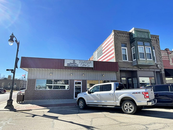 Stars, stripes, and espresso! Sabetha's Downtown Coffee Co. nestles beneath a patriotic mural that proves American values and caffeine addiction go hand-in-hand.
