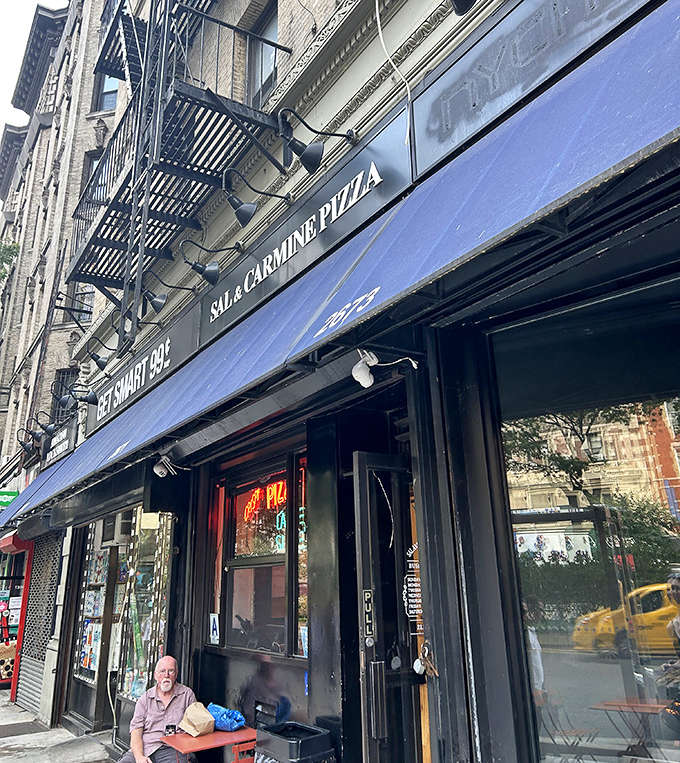 Broadway's pizza paradise where every slice delivers more drama than a soap opera finale.