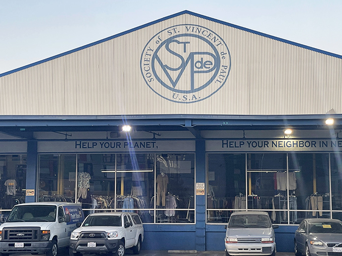 The Society's thrift store glows in evening light. Those illuminated windows showcase their dual mission of planet-saving and neighbor-helping.