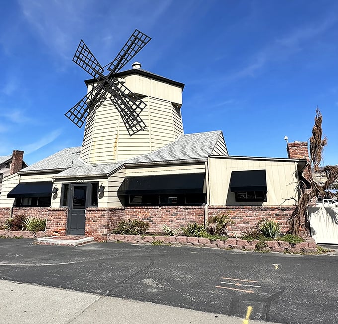 That towering windmill isn't just decoration - it's a beacon calling carnivores home to comfort food paradise.