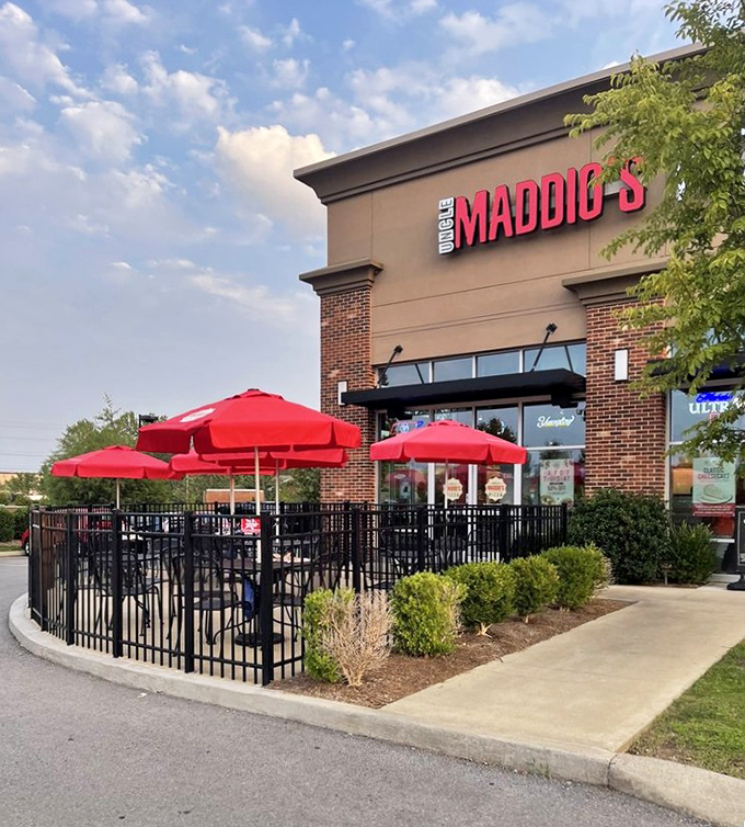 Those cheerful red umbrellas create the perfect spot for pizza and people-watching - pure bliss.