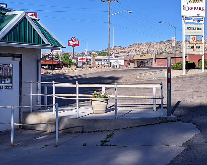Small-town architecture stands proud against mountain backdrops that dwarf city skylines everywhere.