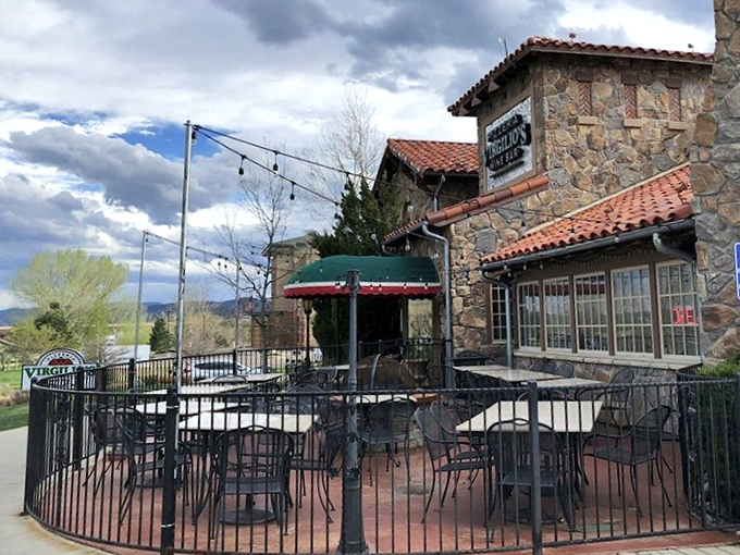 Stone walls and Mediterranean charm create the perfect setting for wine-paired pizza perfection.