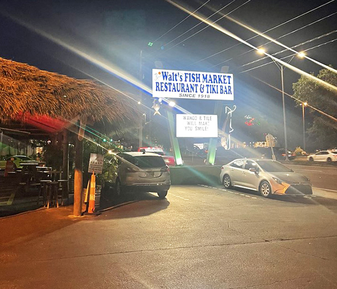 Evening lights illuminate this tiki-inspired haven where fresh fish meets island-style hospitality and charm.