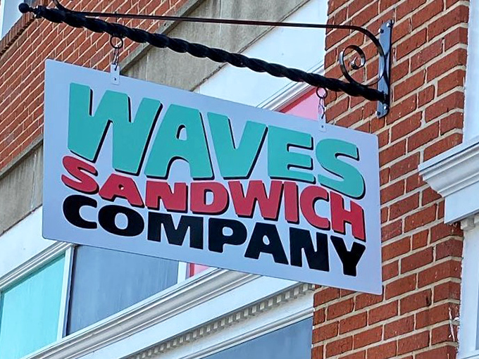 The hanging sign at Waves Sandwich Company swings with promise. Inside awaits a tide of delicious possibilities.