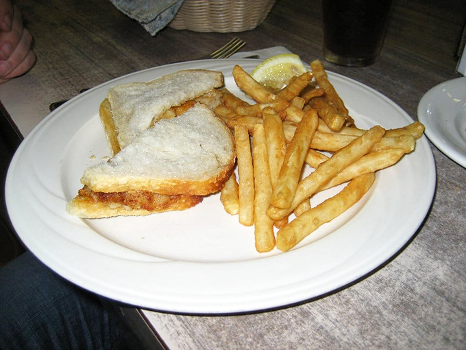 Simple pleasures done right: a classic sandwich with golden fries that proves sometimes the straightforward approach trumps all the fancy foams in the world.