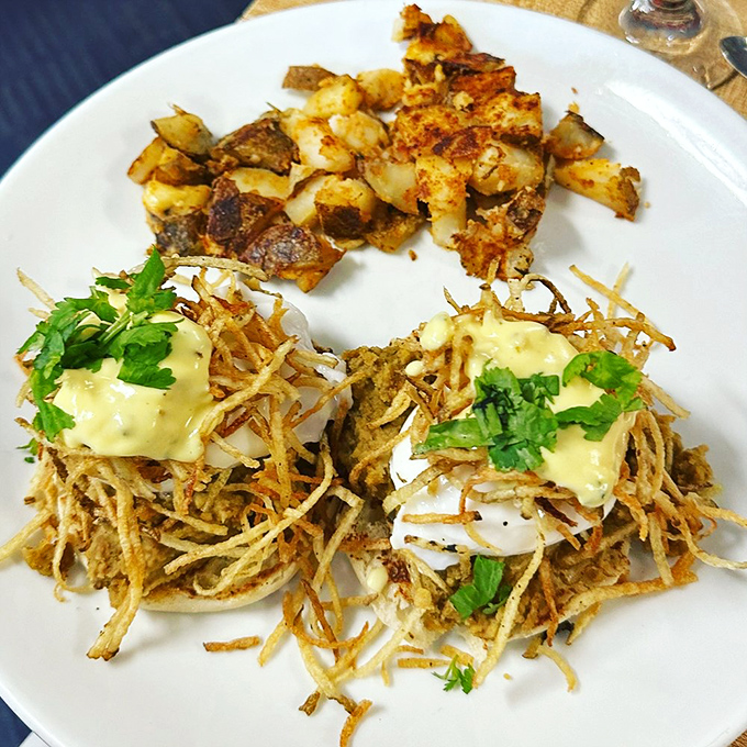 Hash browns reimagined with African spices, topped with eggs wearing hollandaise like Sunday's best hat.