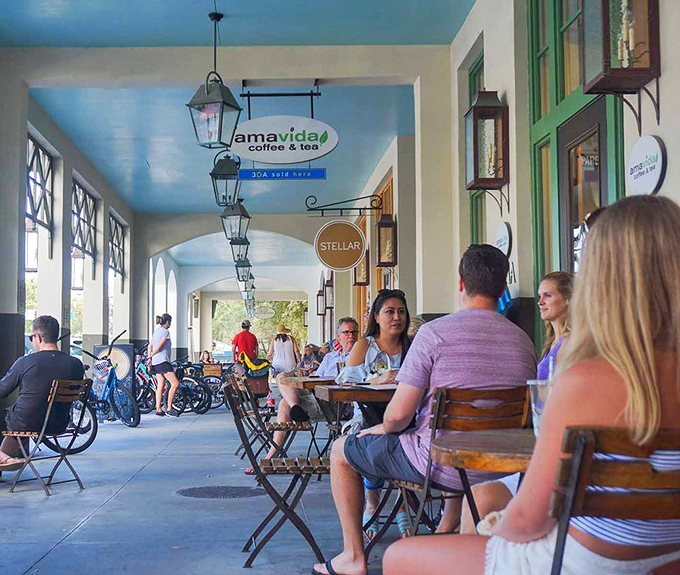 Amavida Coffee's shaded arcade offers the perfect perch for caffeine consumption and contemplation of life's greater mysteries.