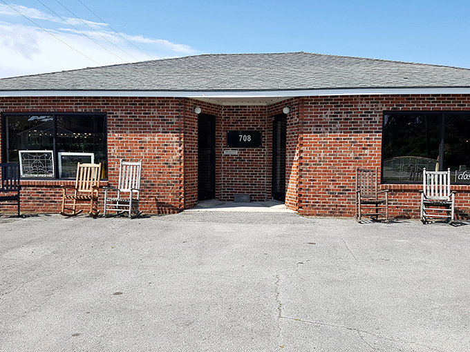 Rocking chairs outside a brick storefront&mdash;the universal Southern signal that says "slow down and stay awhile."
