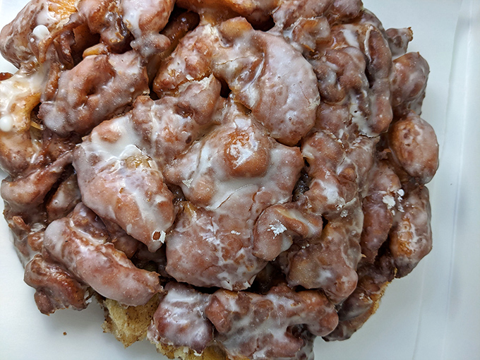 This apple fritter looks like it bench-presses other pastries in its spare time. A heavyweight champion in the world of breakfast indulgences.