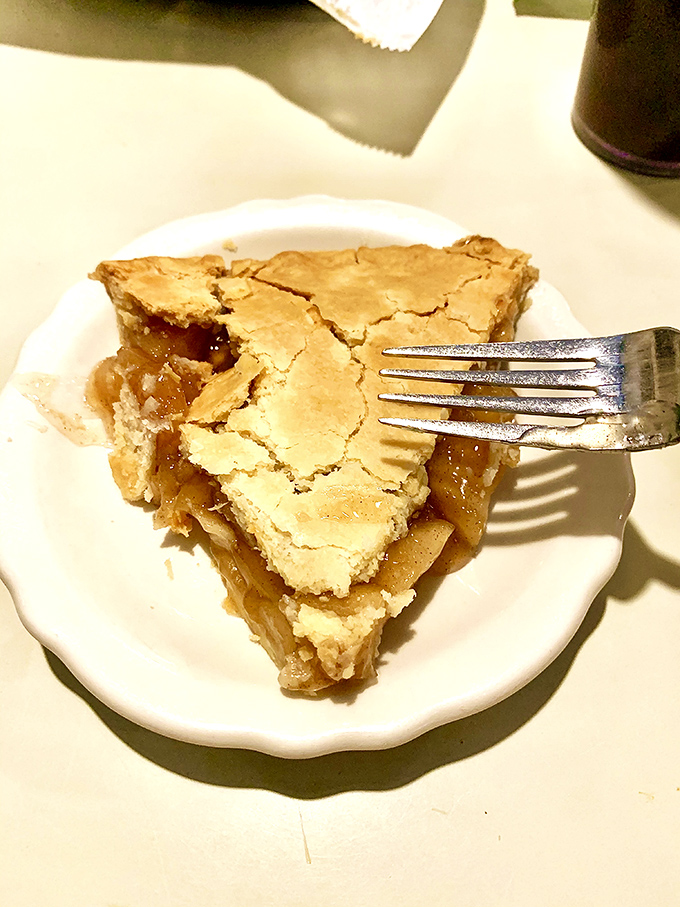 The apple pie's flaky crust shatters delicately, revealing cinnamon-kissed fruit that would make your grandmother both jealous and proud.