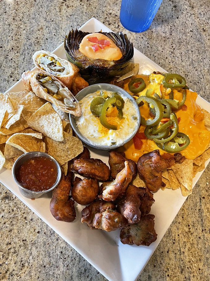 The artichoke sampler brings fire-roasted, deep-fried, steamed varieties, nachos, and dips—it's basically artichoke graduate school on a plate.