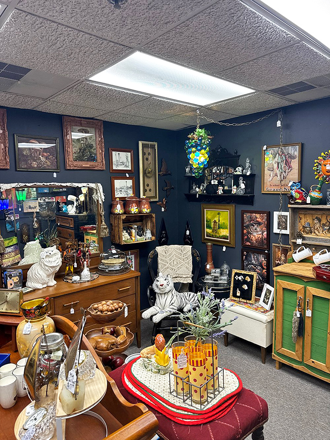 A mid-century modern dream where that tiger figurine somehow makes perfect sense alongside vintage serving dishes and art.