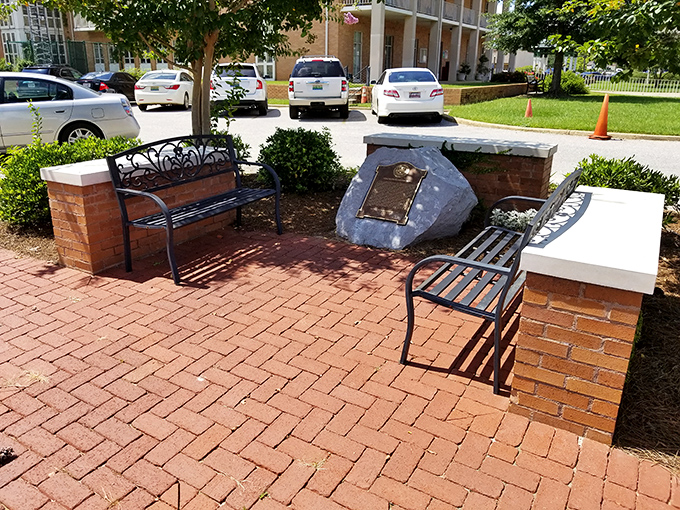 This thoughtfully designed brick plaza provides a perfect spot for downtown contemplation&mdash;Southern hospitality in bench form. 