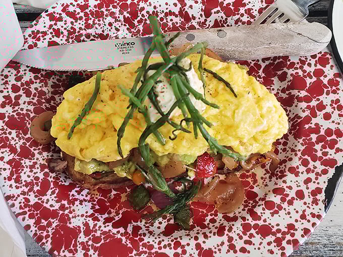 Their avocado toast laughs at basic versions everywhere&mdash;loaded with fresh ingredients on a red speckled plate that's as cheerful as the food.